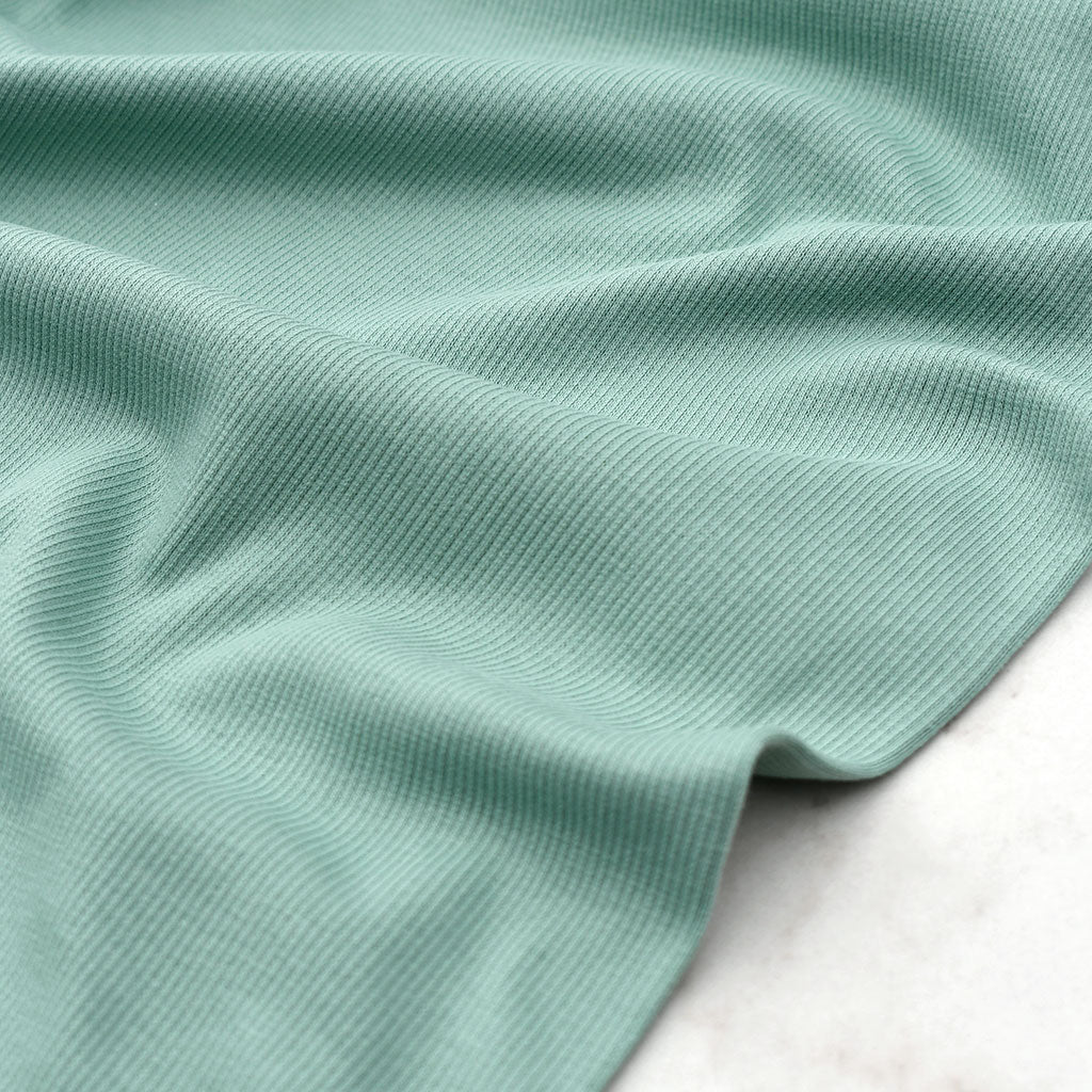 See You at Six Solid Cotton Ribbing Granite Green – Style Maker Fabrics